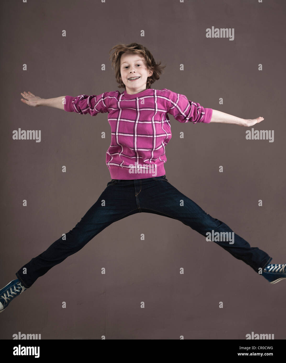 Boy leaping into the air Stock Photo - Alamy