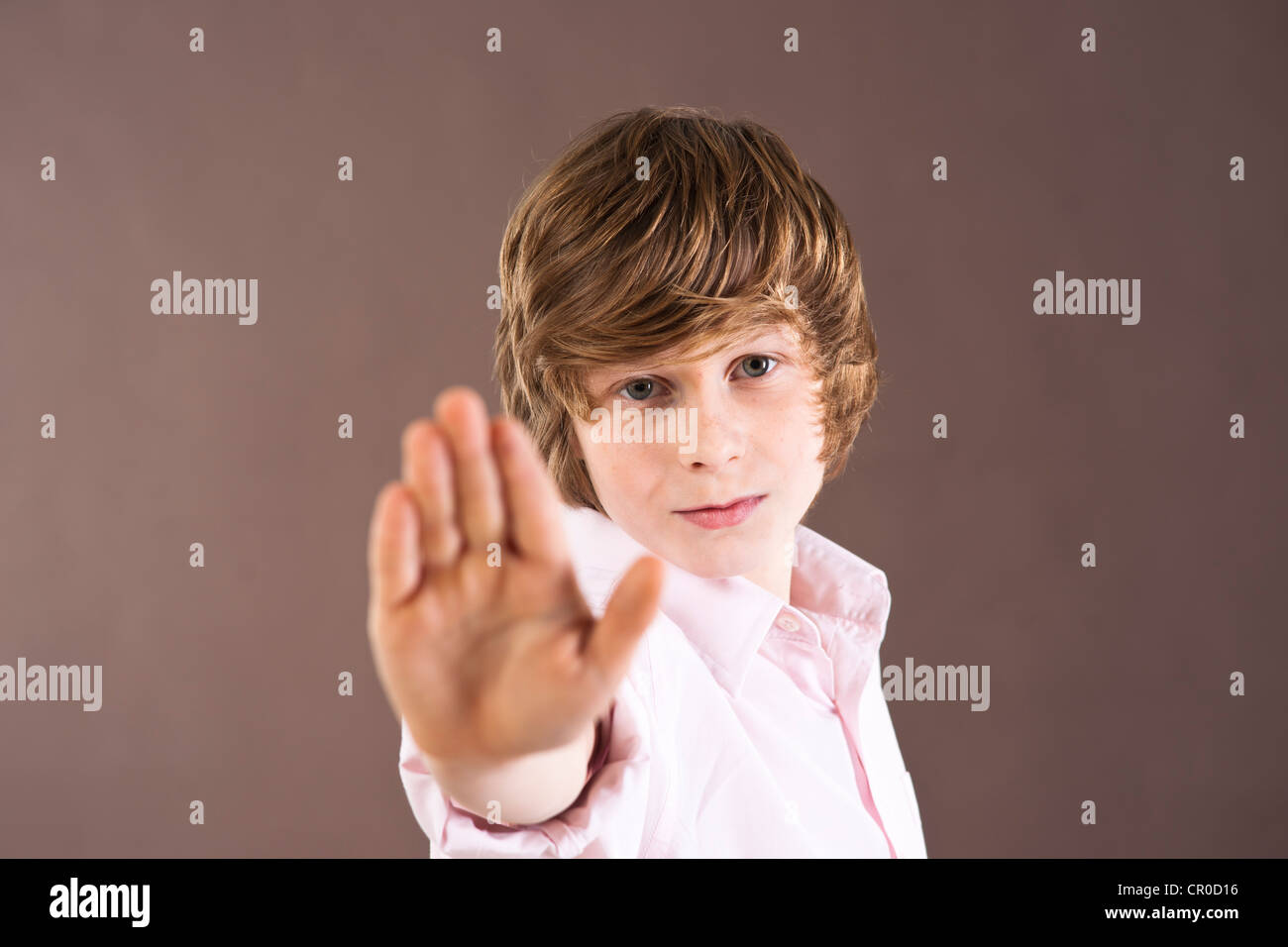 Boy with his hand stretched forward Stock Photo - Alamy