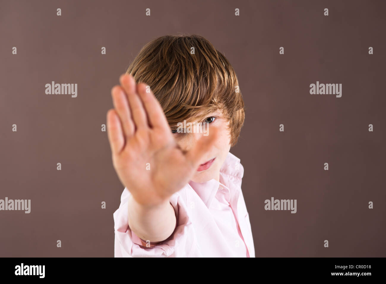 Boy with his hand stretched forward Stock Photo - Alamy