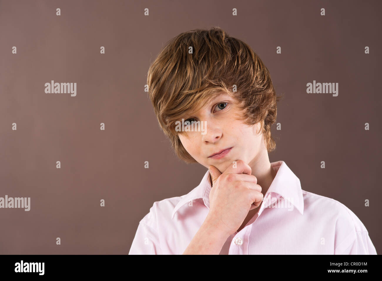 Boy with a contemplative expression, portrait Stock Photo - Alamy