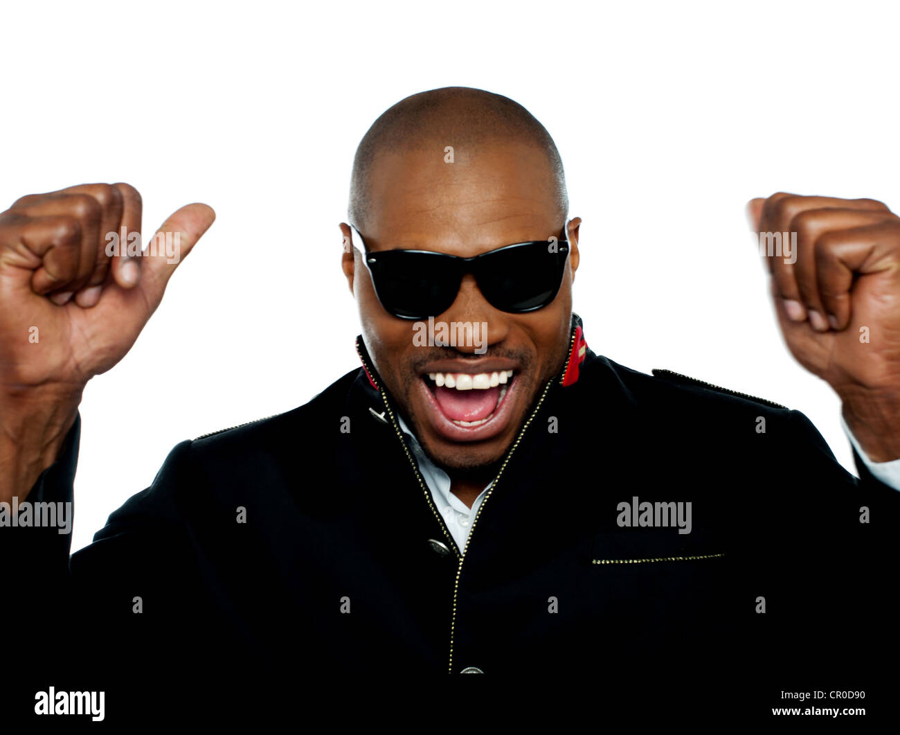 Excited young african man shouting in excitement with arms up. Closeup ...