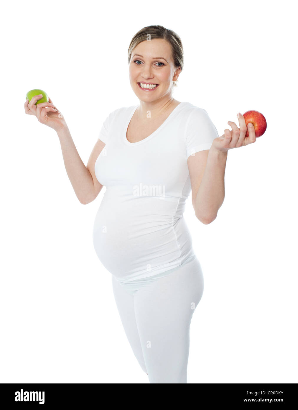 Beauiful pregnant woman showing two different colors of apple. Red and ...