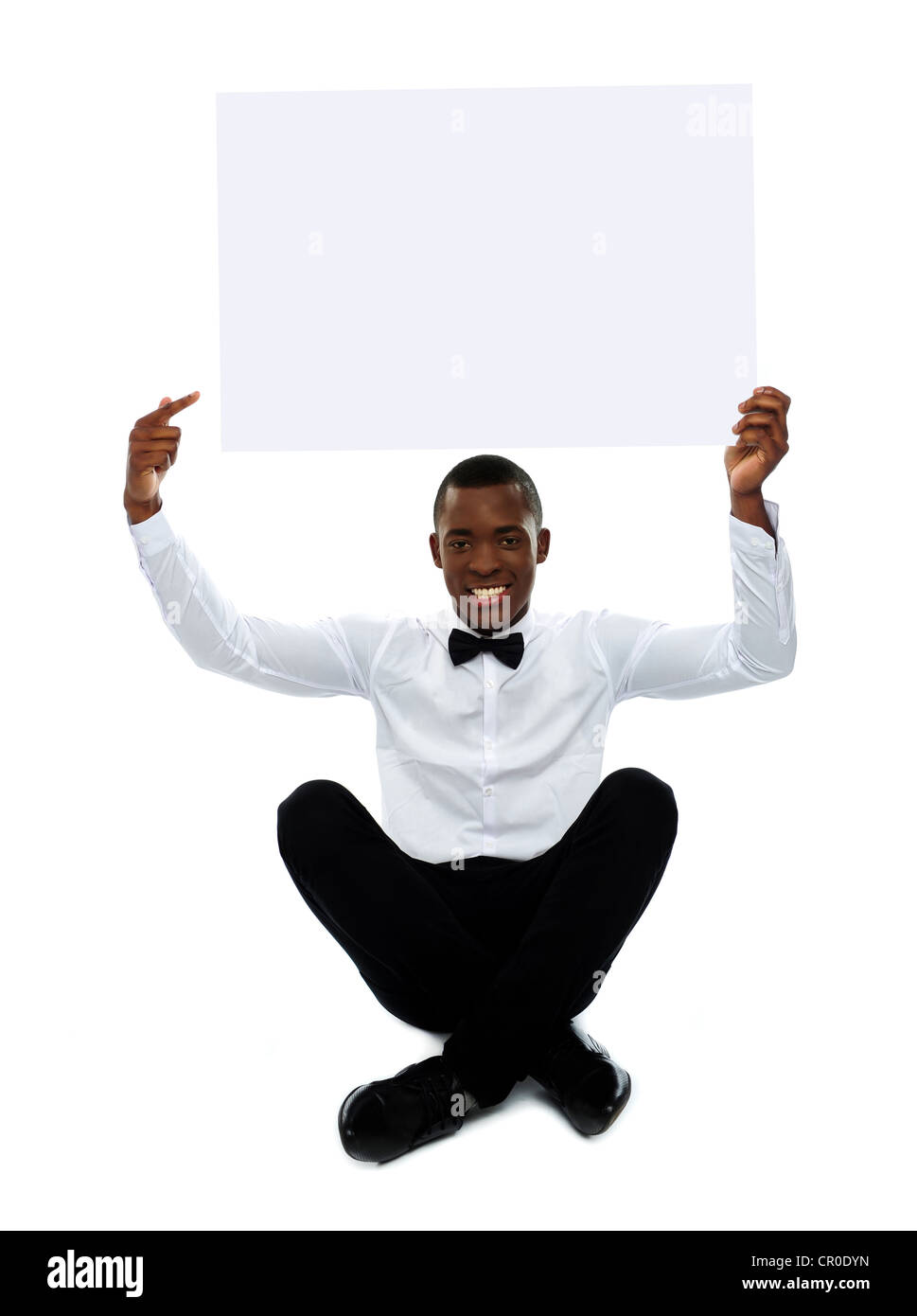 Seated black man pointing towards blank billboard over his head Stock ...
