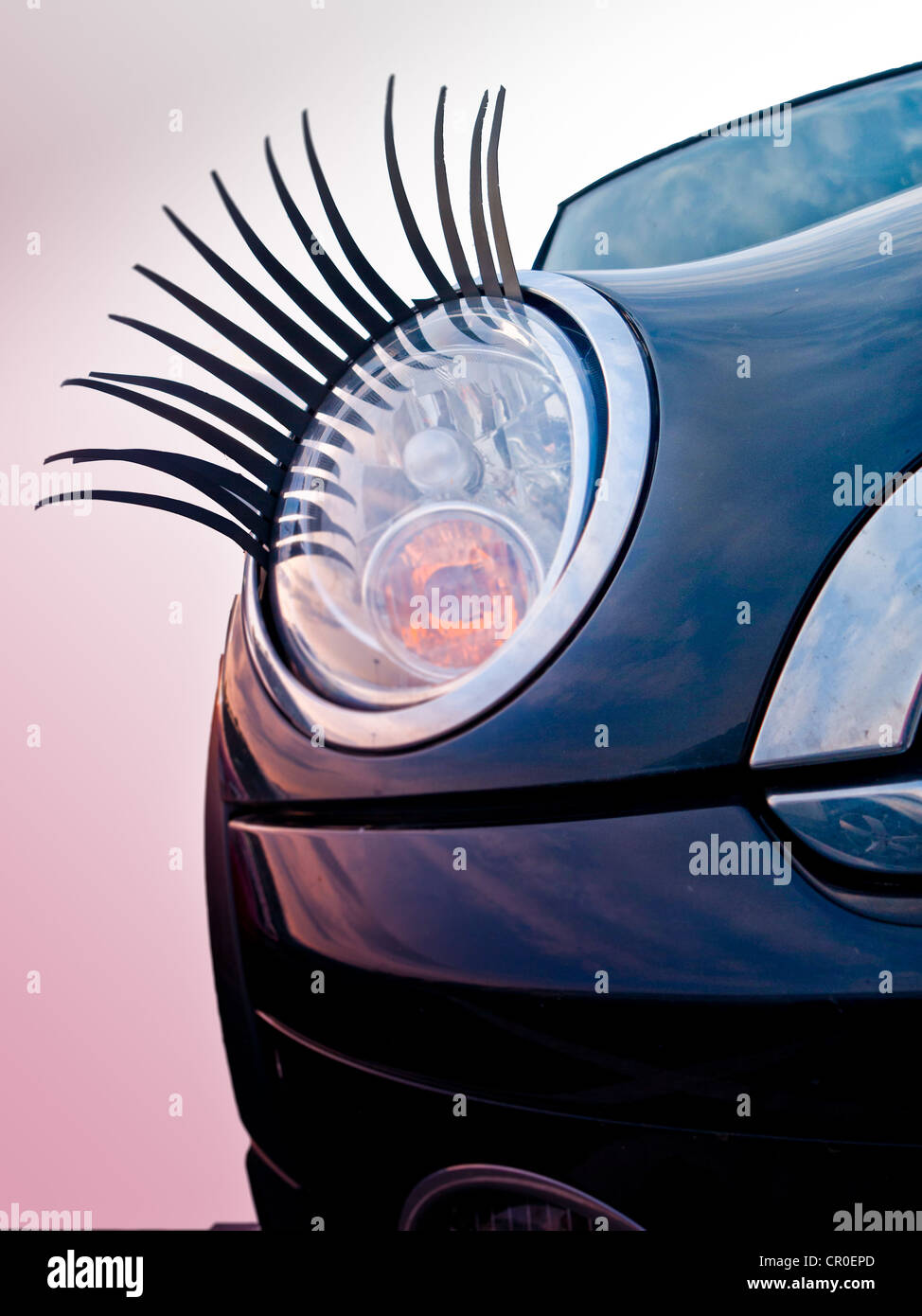 Mini car with eyelash Stock Photo - Alamy