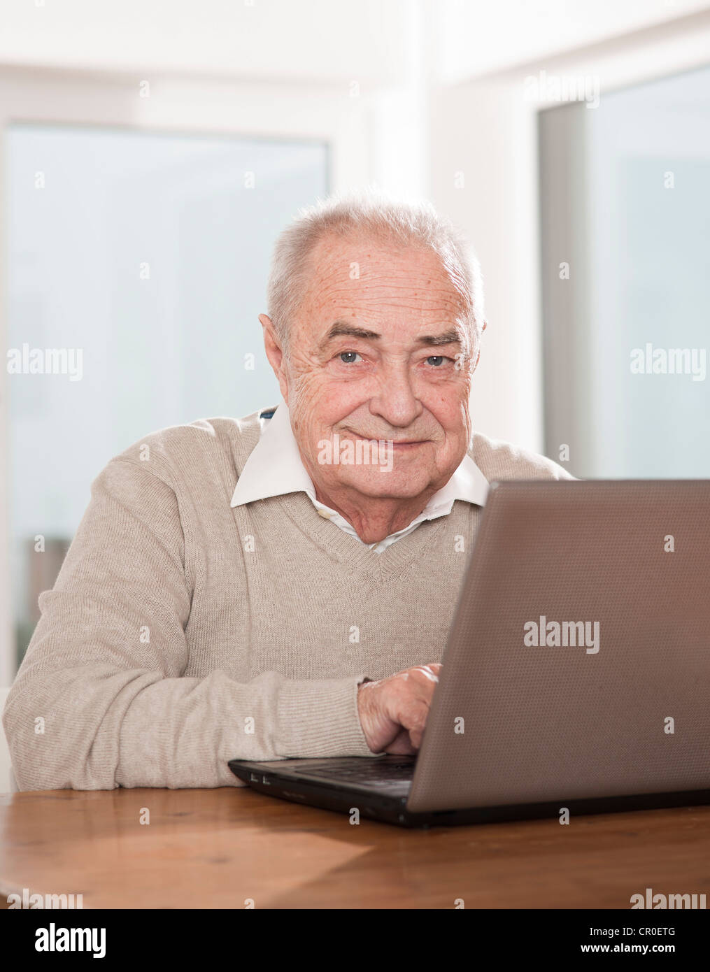Elderly man using a PC Stock Photo - Alamy