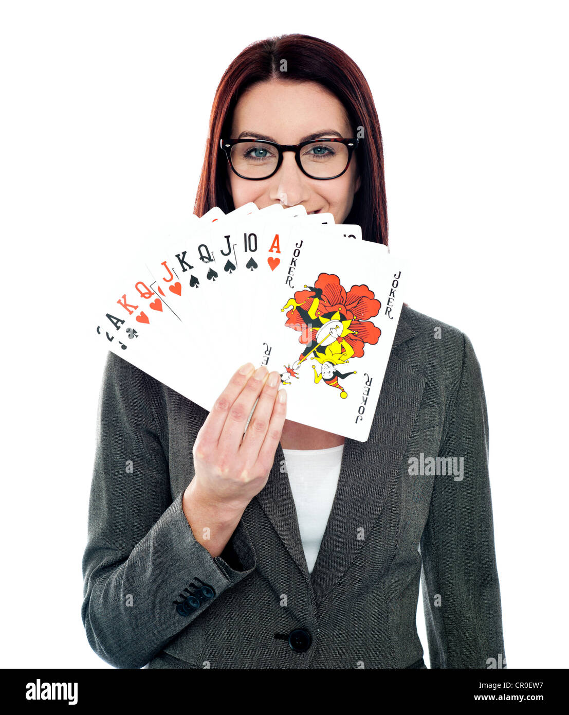 Corporate lady hiding her smile with playing cards isolated on white ...