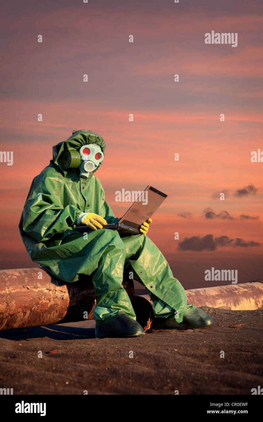 A man in protective suit works in the area of chemical contamination ...