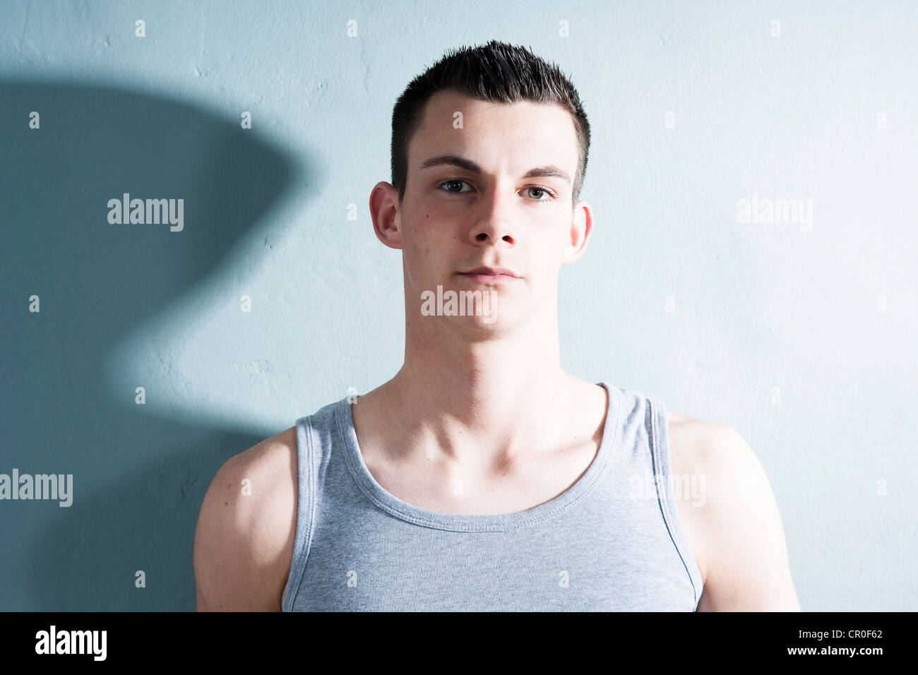Cool young man wearing a singlet Stock Photo - Alamy