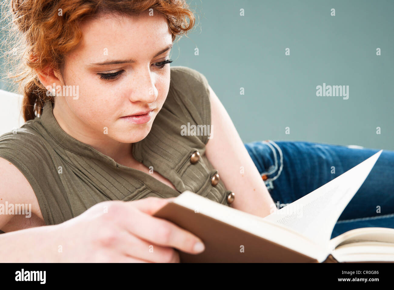 Girl reading a book Stock Photo - Alamy