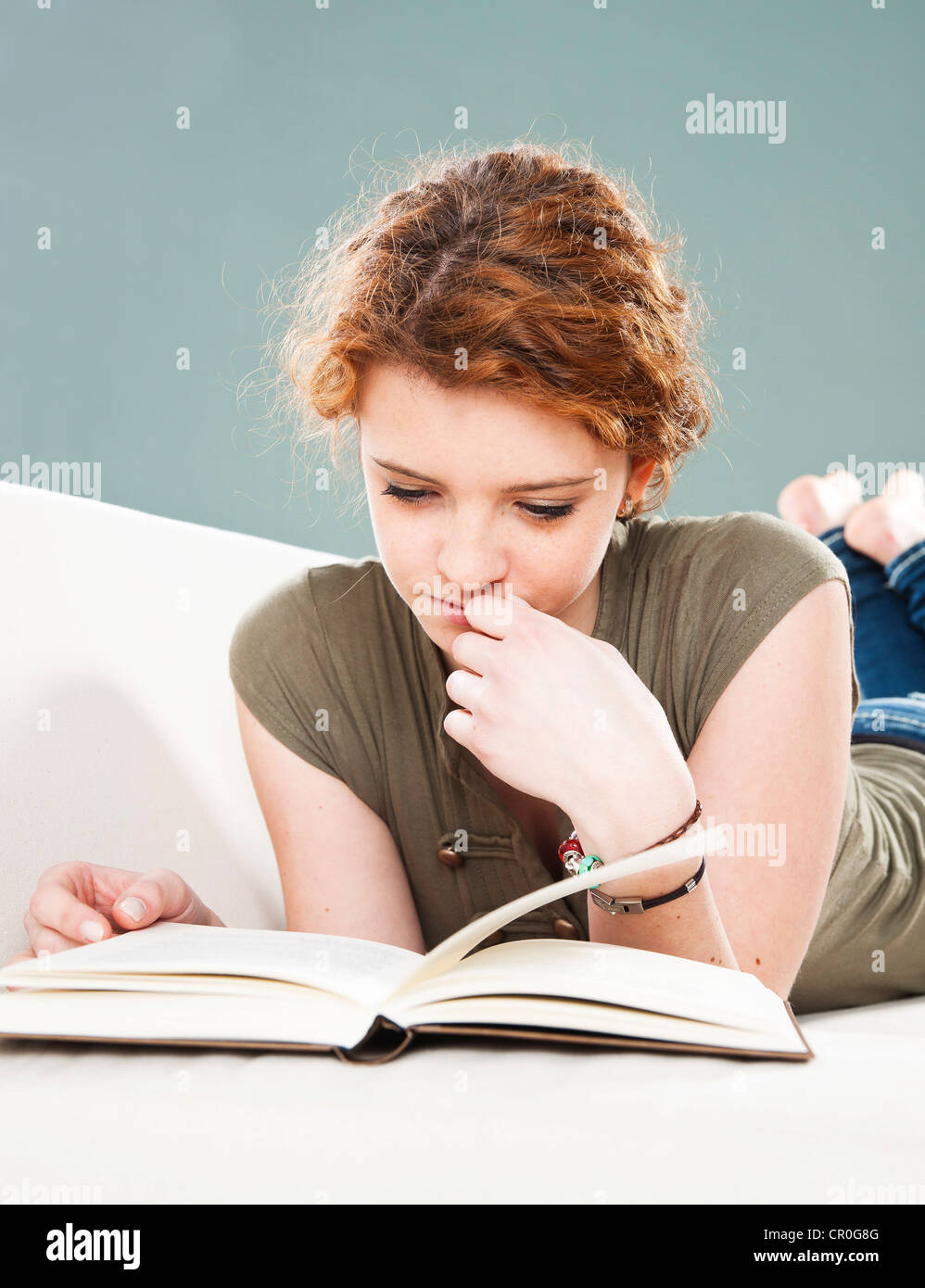 Girl reading a book Stock Photo - Alamy