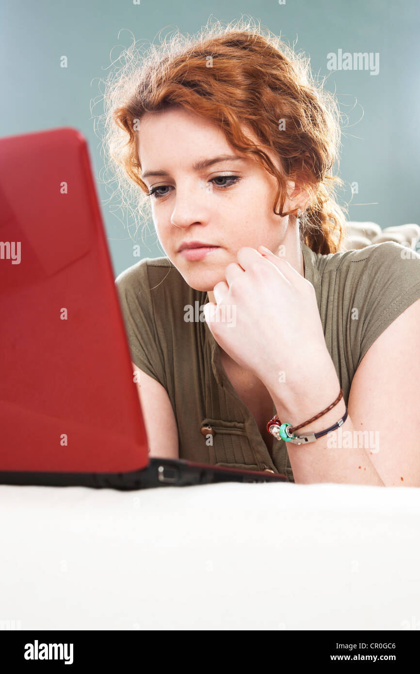 Girl using a laptop Stock Photo - Alamy