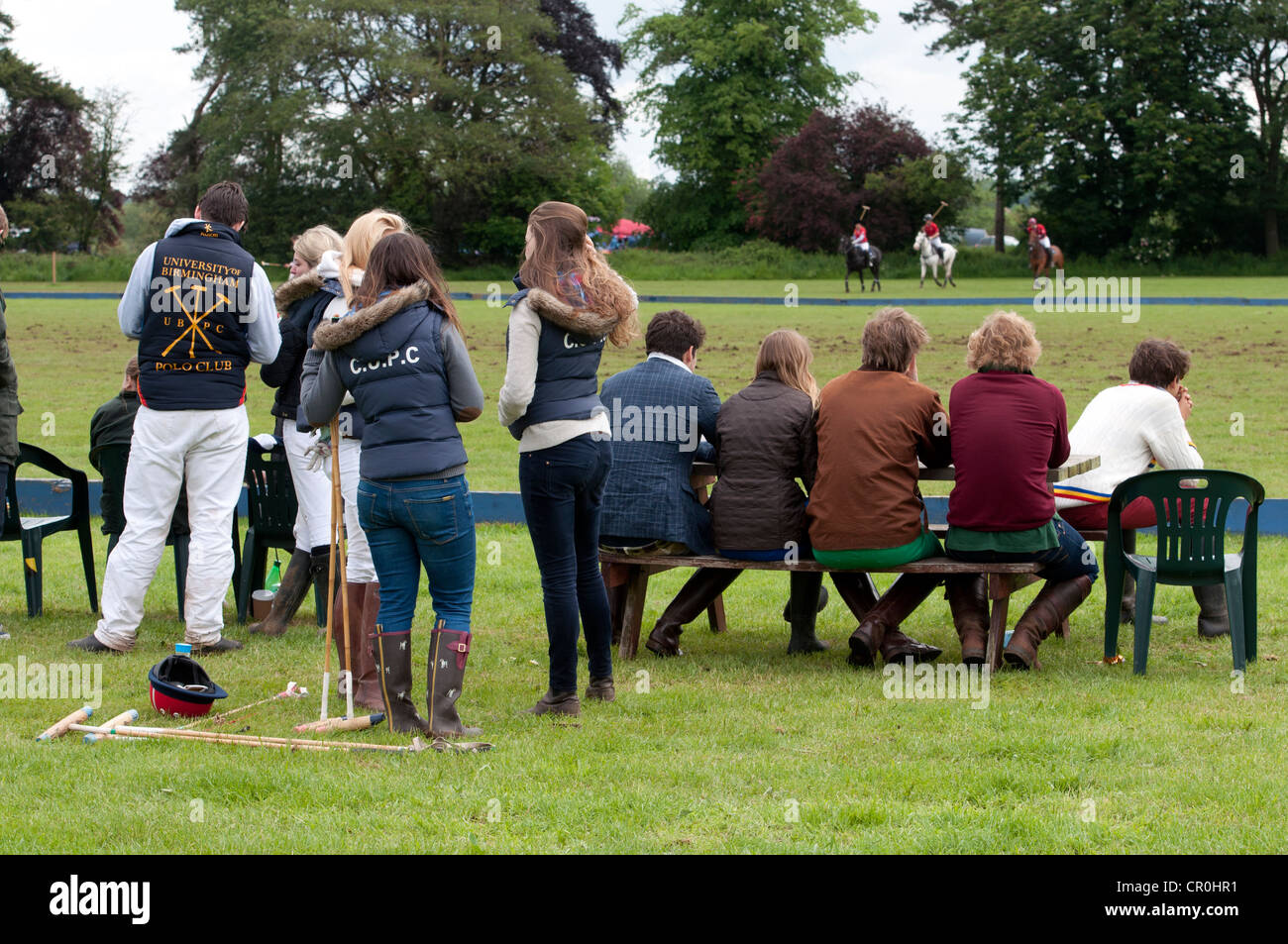Students watching polo game Stock Photo - Alamy