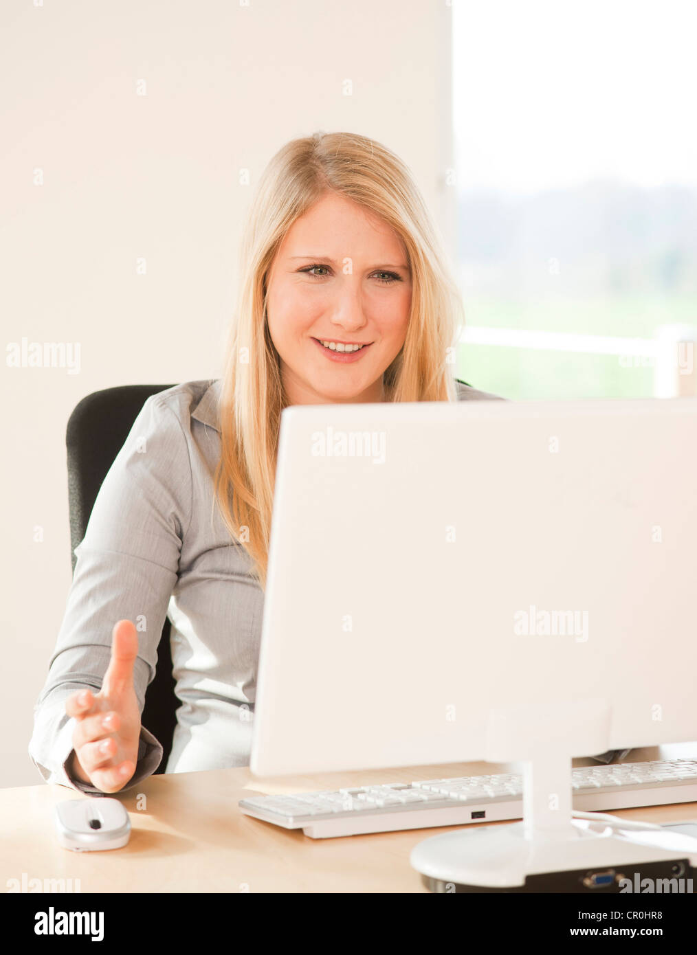 Young woman working on computer Stock Photo - Alamy