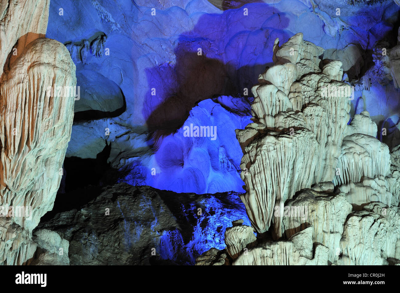 Colourfully, illuminated rock formation in Hang Sung Sot cave, Surprise ...