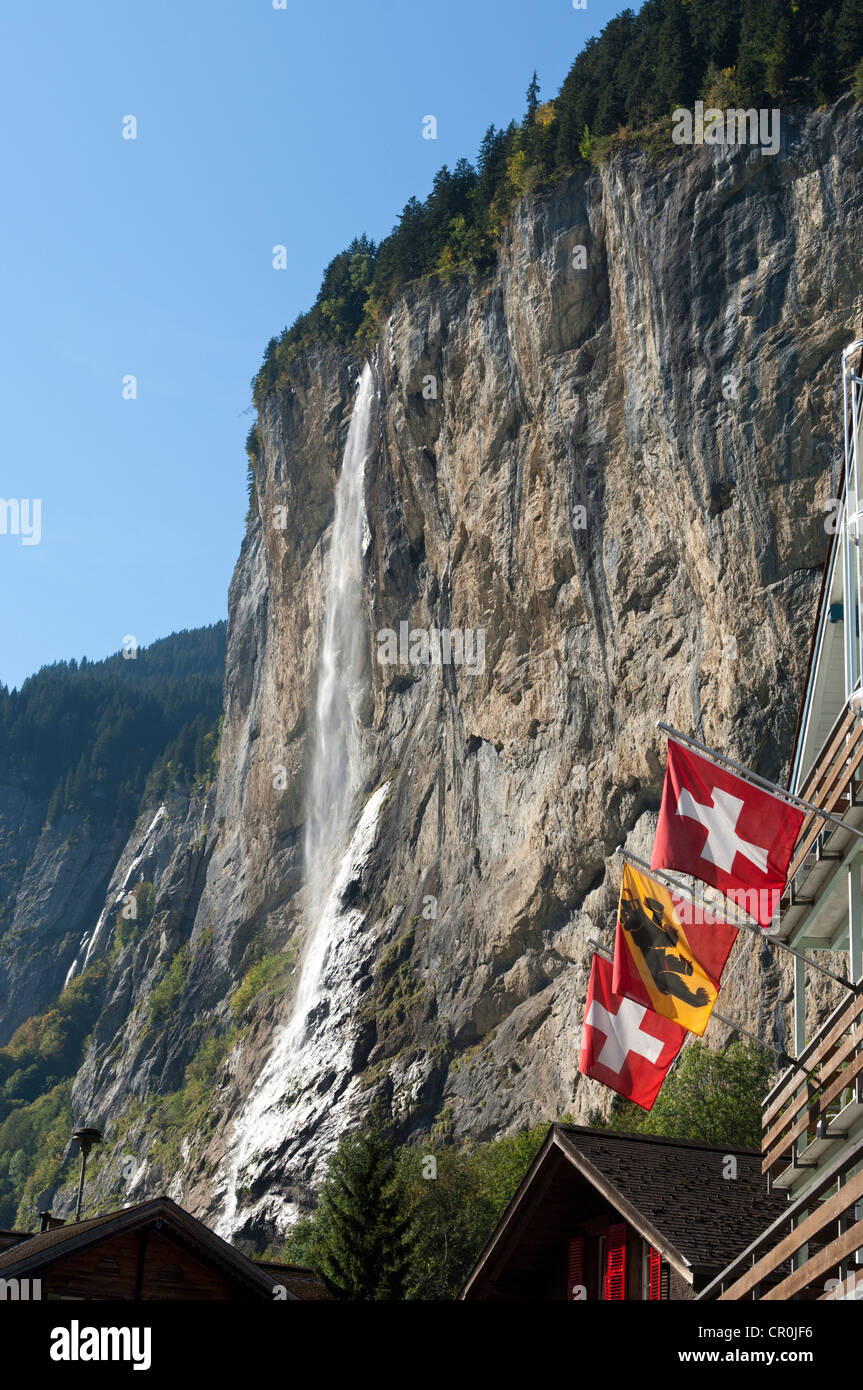 Staubach Falls and flags of Switzerland and the canton of Bern ...