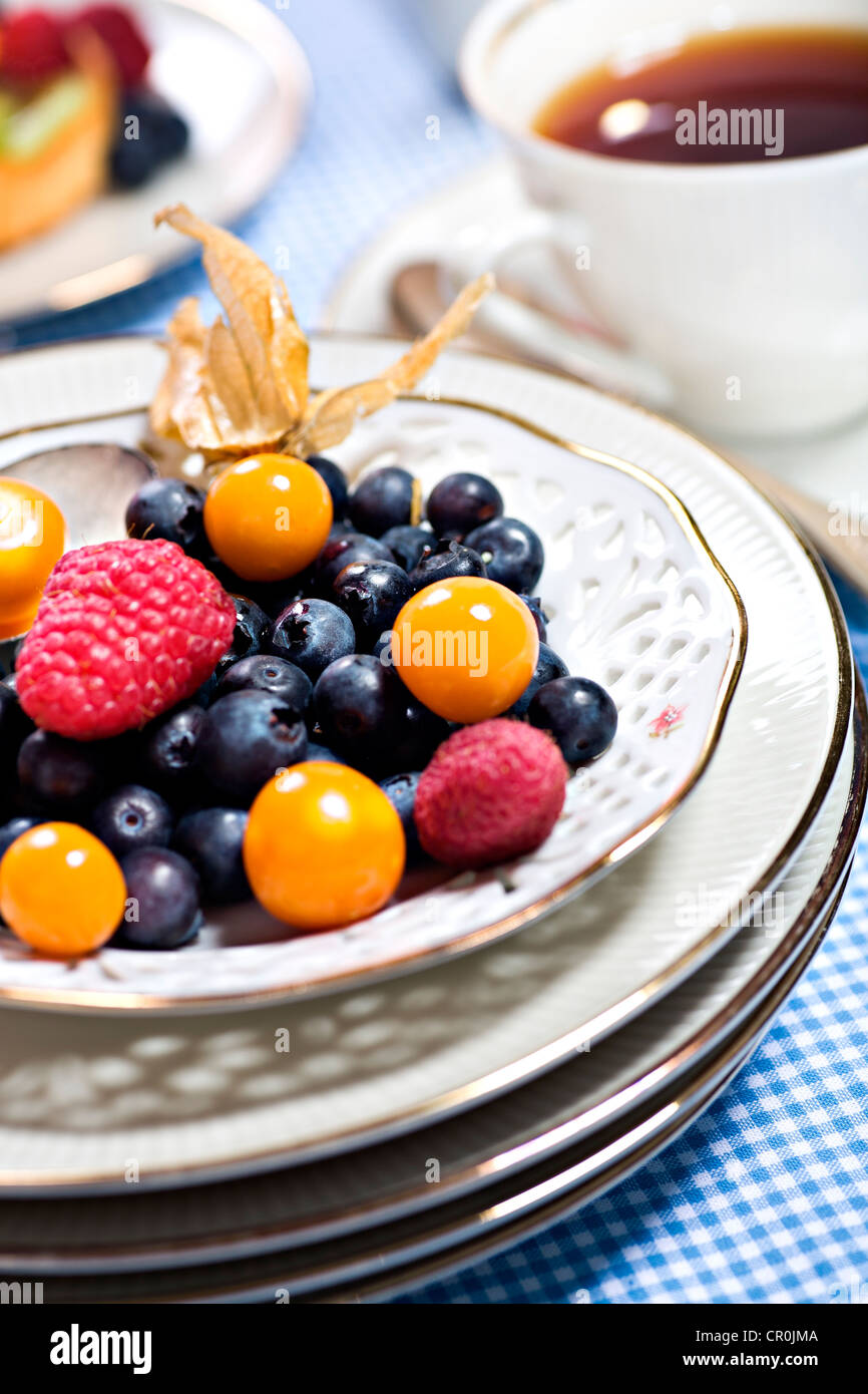 Mixed berries on a plate Stock Photo - Alamy