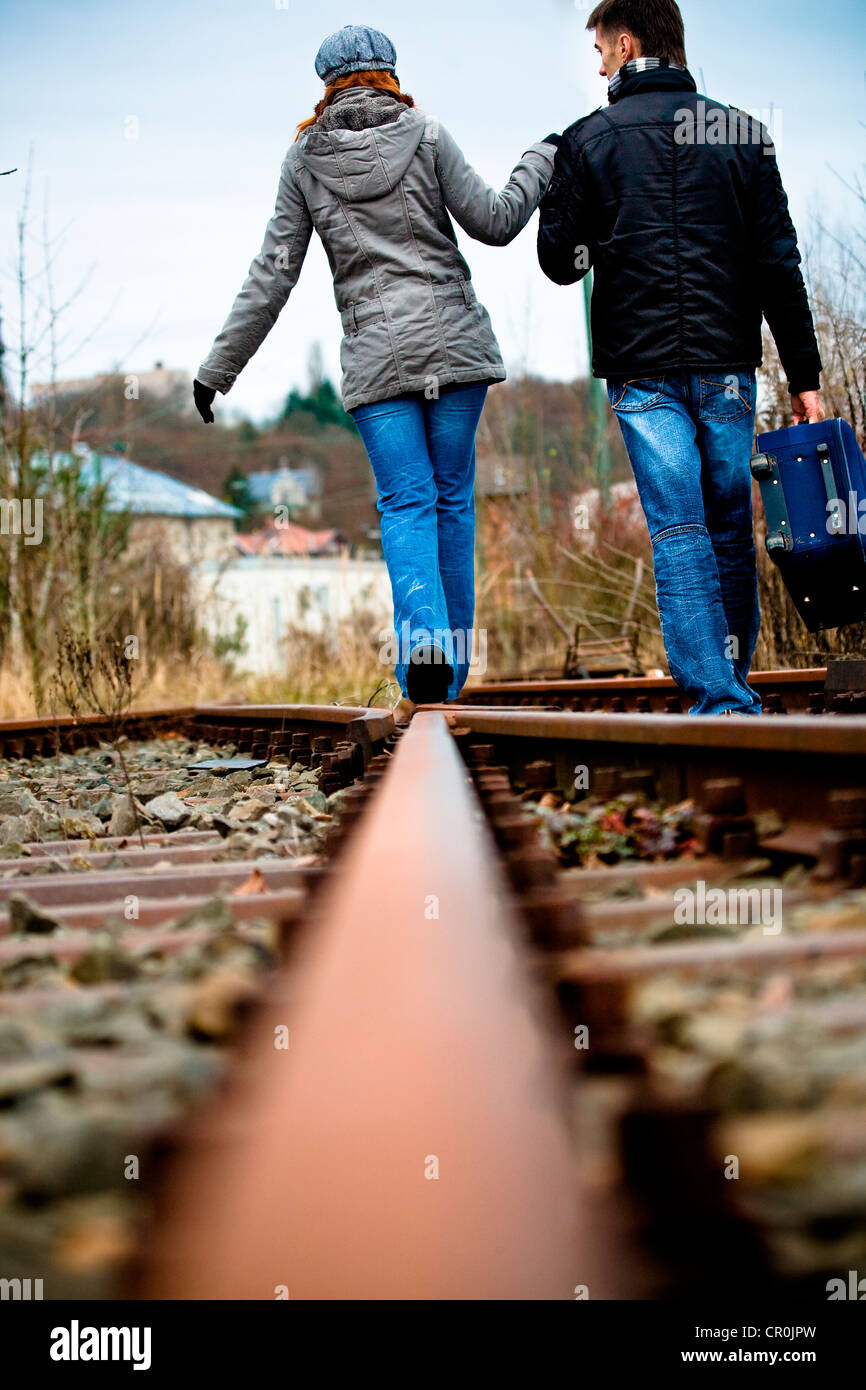 Couples walking on railway track hi-res stock photography and images ...