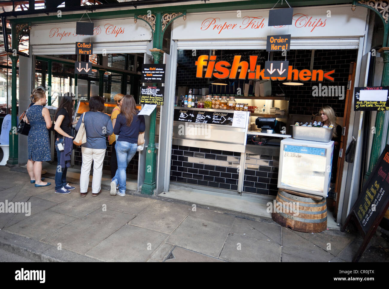 Queue of people at a fish and chips stall, London, England, UK Stock ...