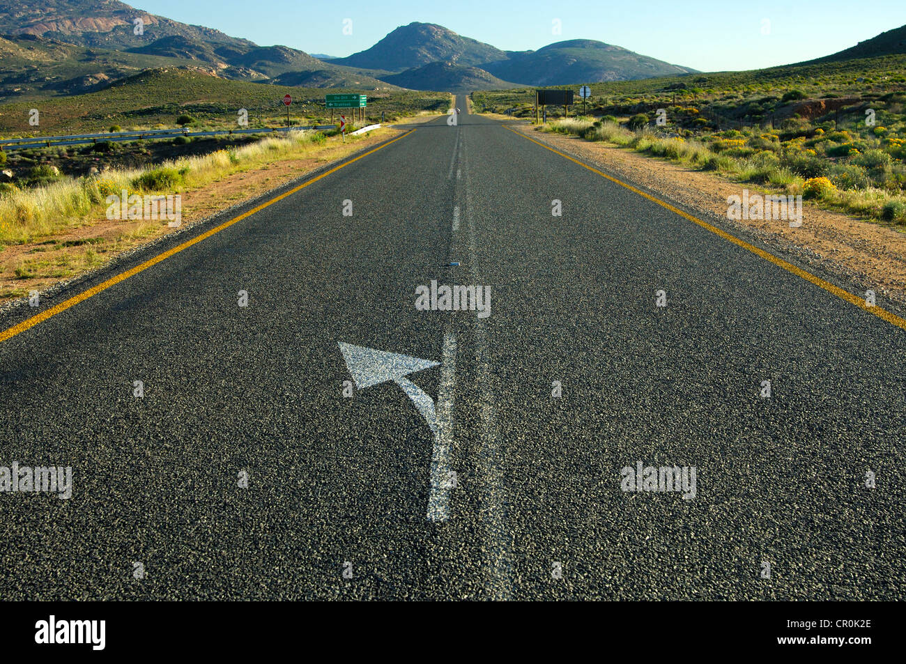 Directional arrow to the left on the straight strip of asphalt at the ...