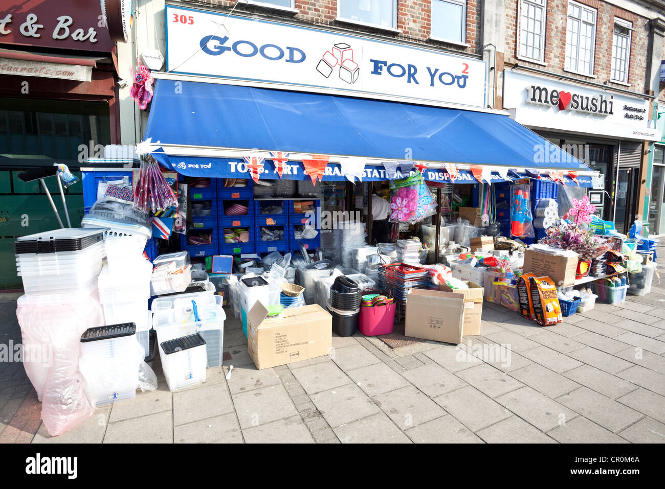 Street shop displaying houseware items on the pavement, Edgware ...