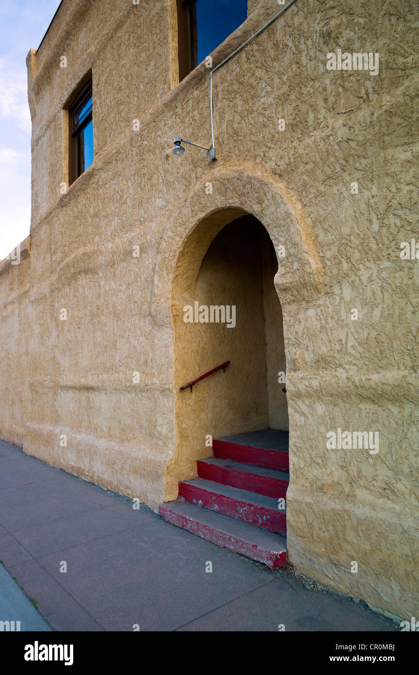 Arched doorway and adobe facade, historic downtown district, small ...