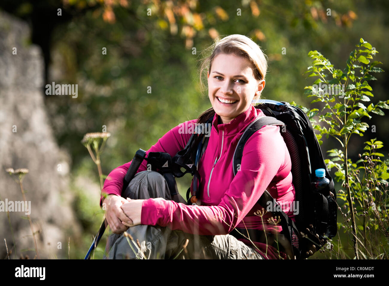 Young woman hiking in the mountains Stock Photo - Alamy