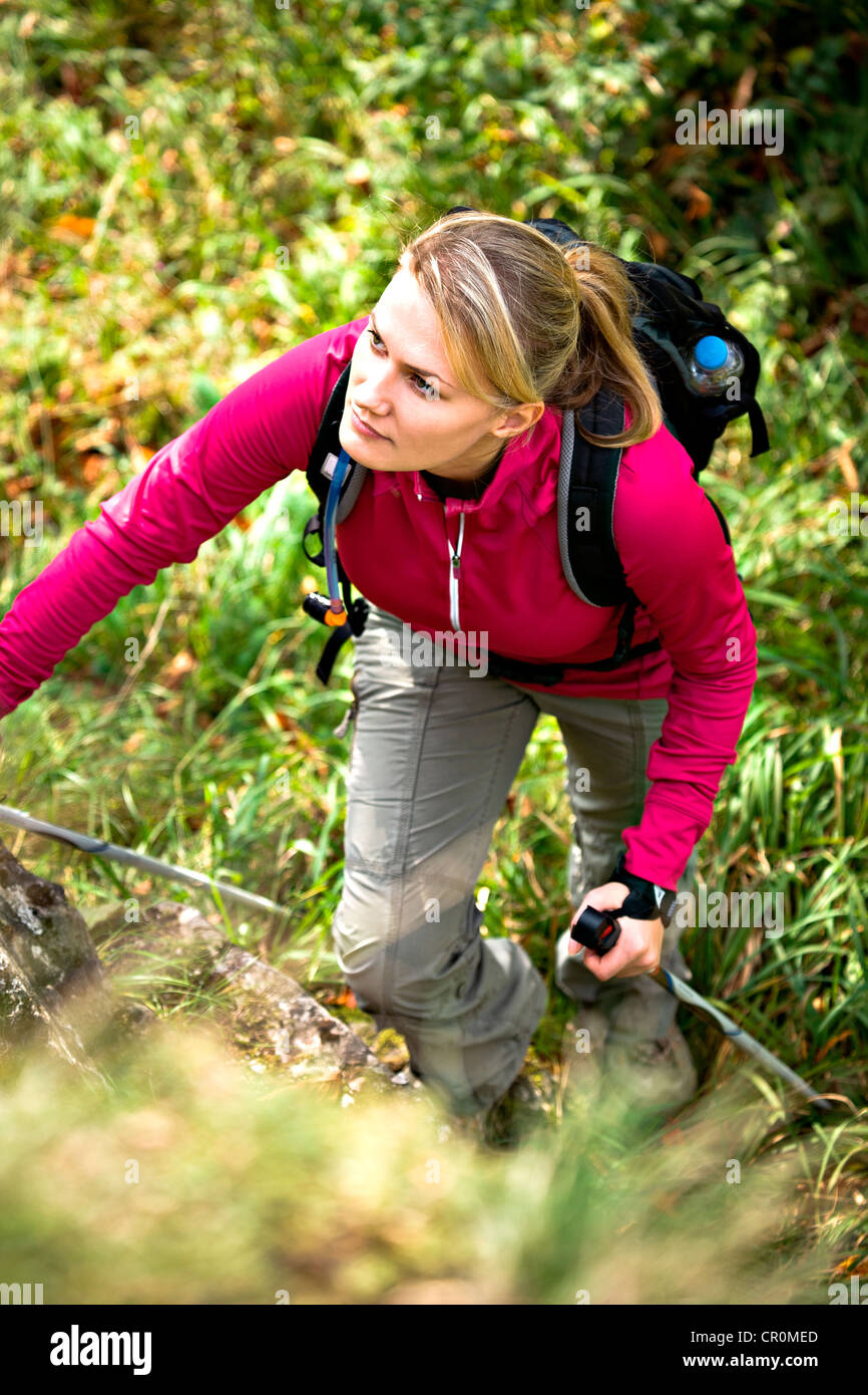 Young woman hiking in the mountains Stock Photo - Alamy