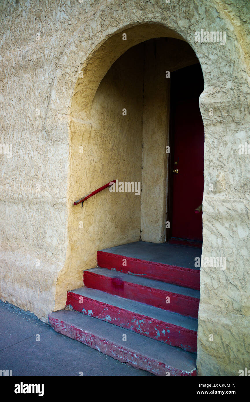 Arched doorway and adobe facade, historic downtown district, small ...