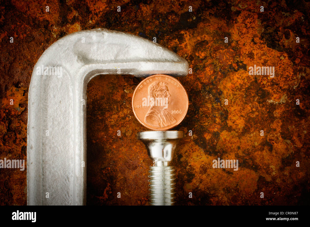 Studio shot of coin in vise grip Stock Photo - Alamy