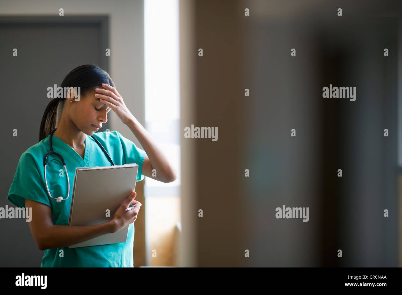 Overworked nurse hi-res stock photography and images - Alamy