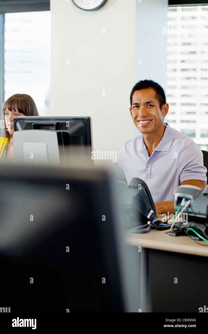 Business people working on computers in office Stock Photo - Alamy