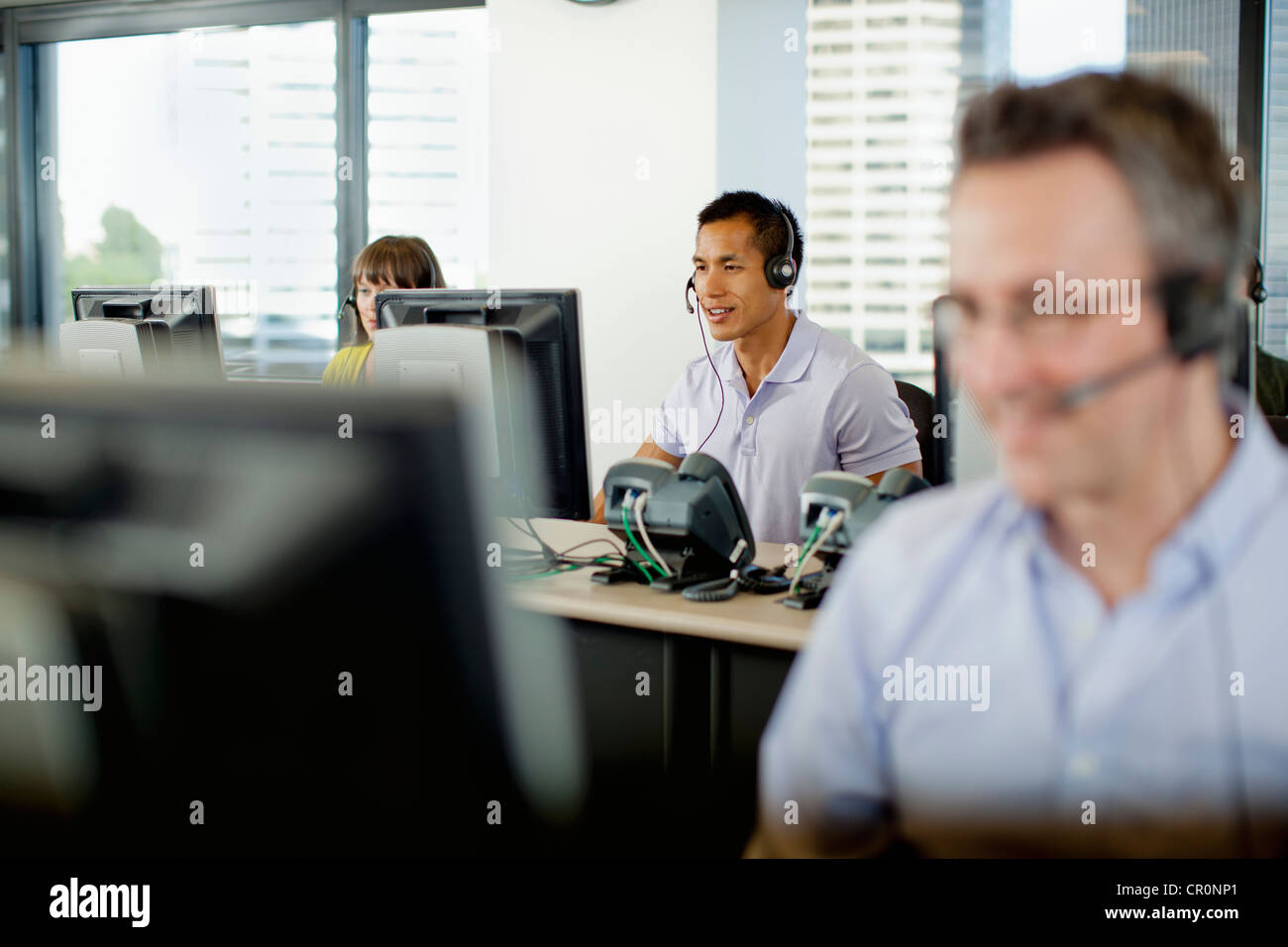Business people working on computers in call center Stock Photo - Alamy