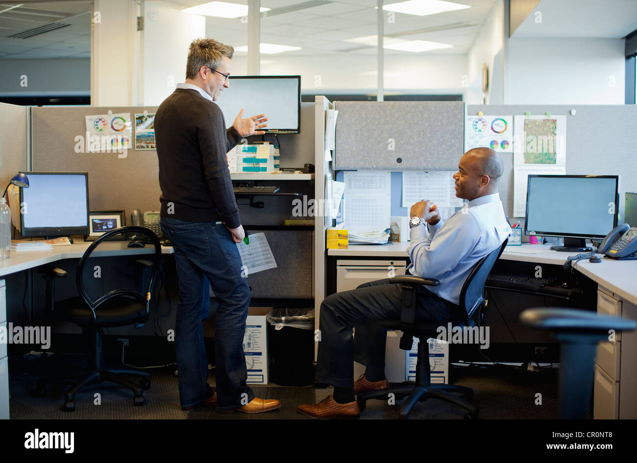 Business people talking in office cubicle Stock Photo - Alamy