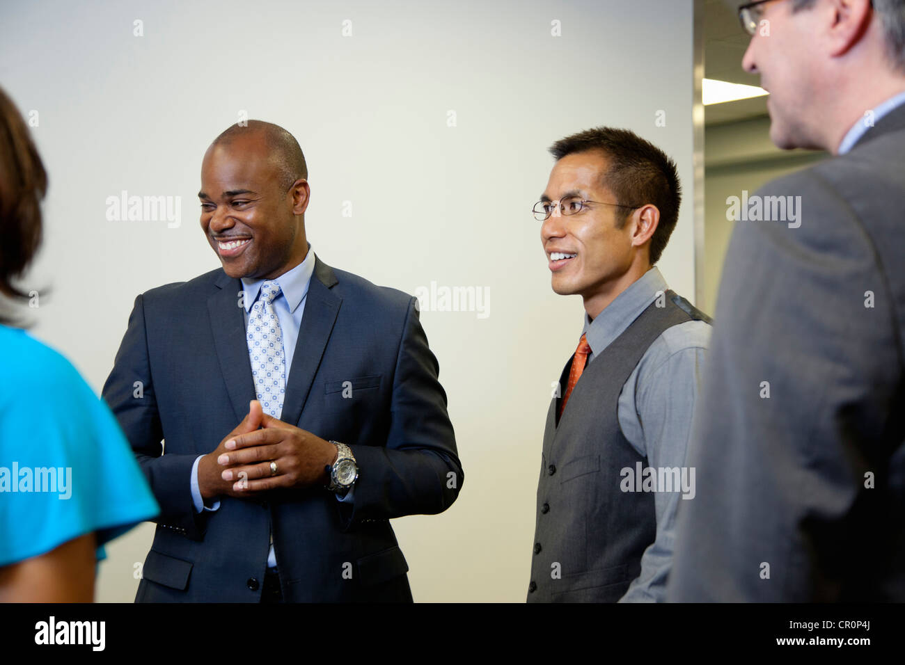 Business people talking together in office Stock Photo - Alamy