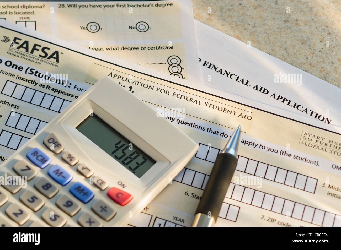 Education Loan application form with a pen and pencil Stock Photo - Alamy