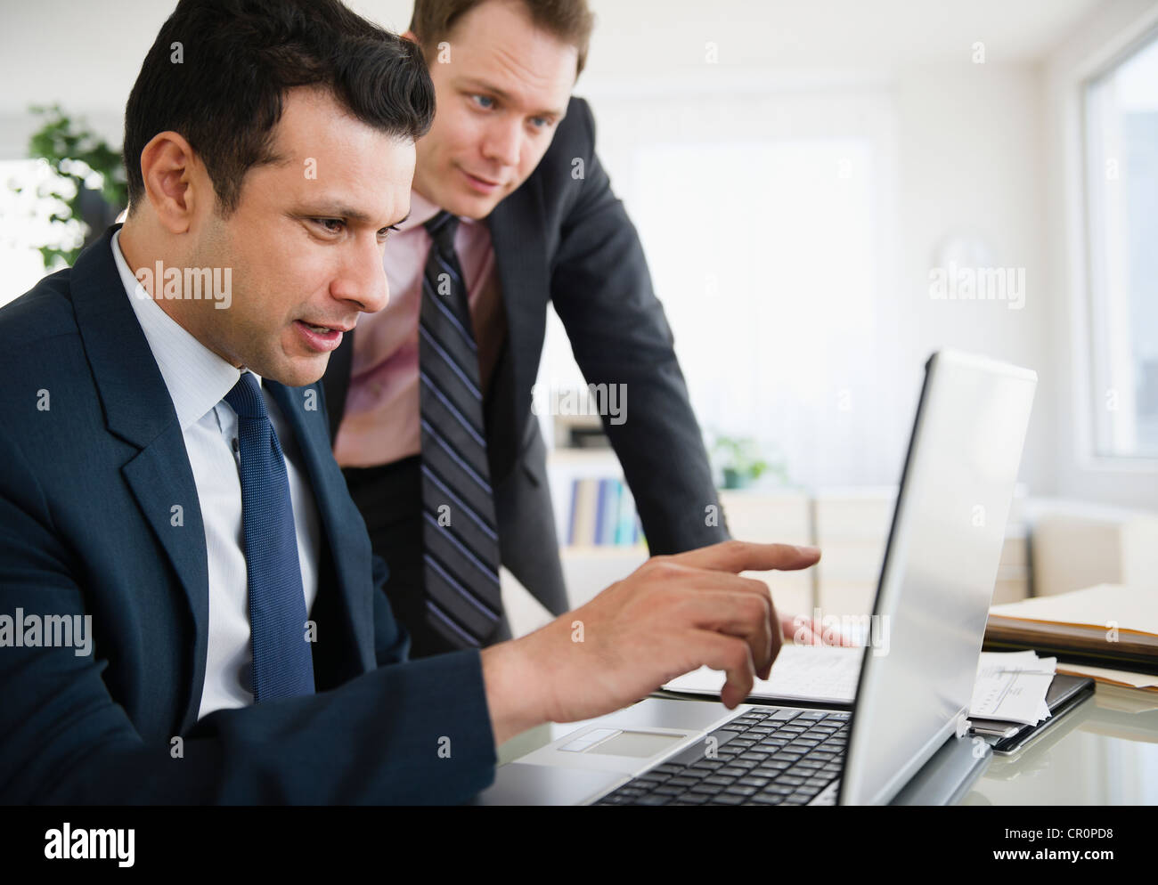 Bending pointing communication explaining hi-res stock photography and ...