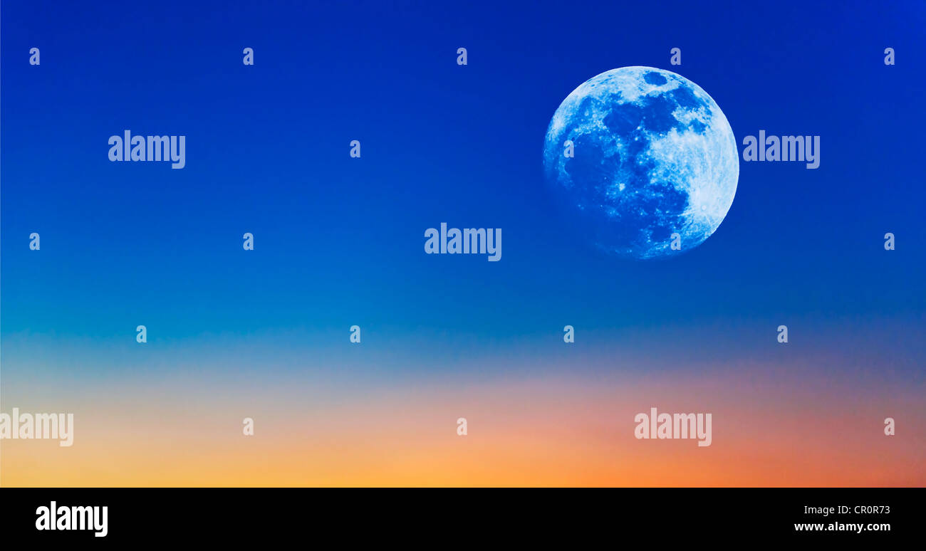 Full moon on evening sky Stock Photo - Alamy