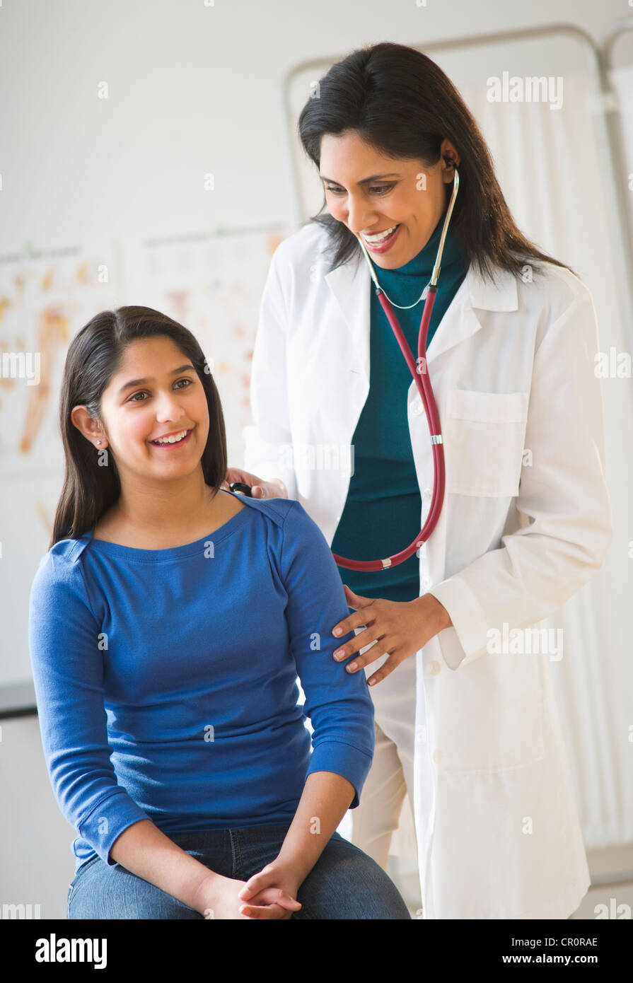 USA, New Jersey, Jersey City, Doctor examining girl (12-13 Stock Photo ...