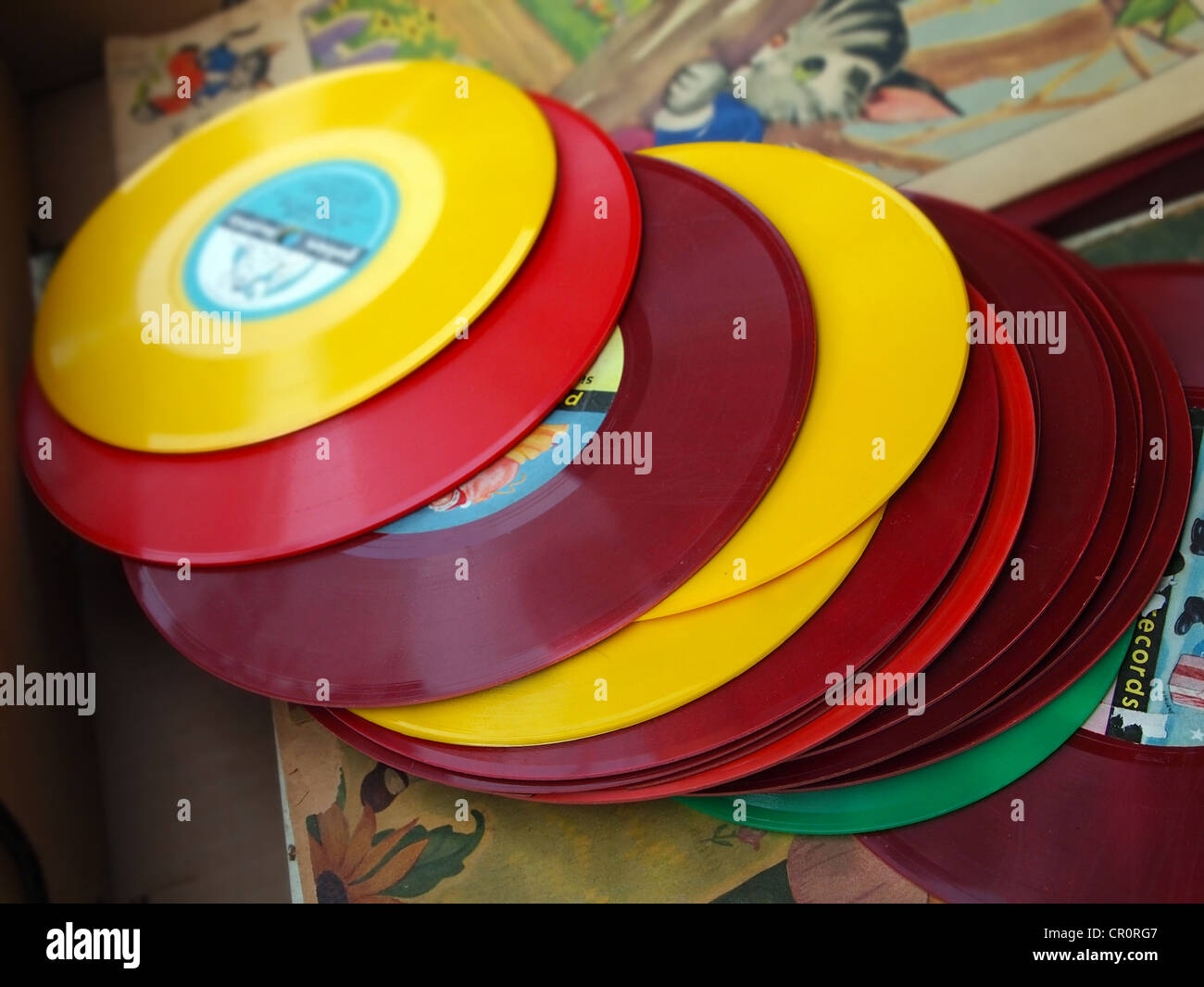 A box of vintage colored vinyl children's records at a yard sale Stock ...