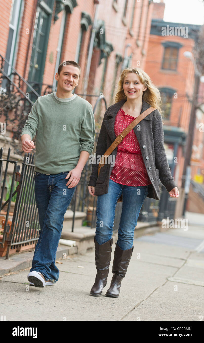 USA, New Jersey, Jersey City, Couple walking on street Stock Photo - Alamy