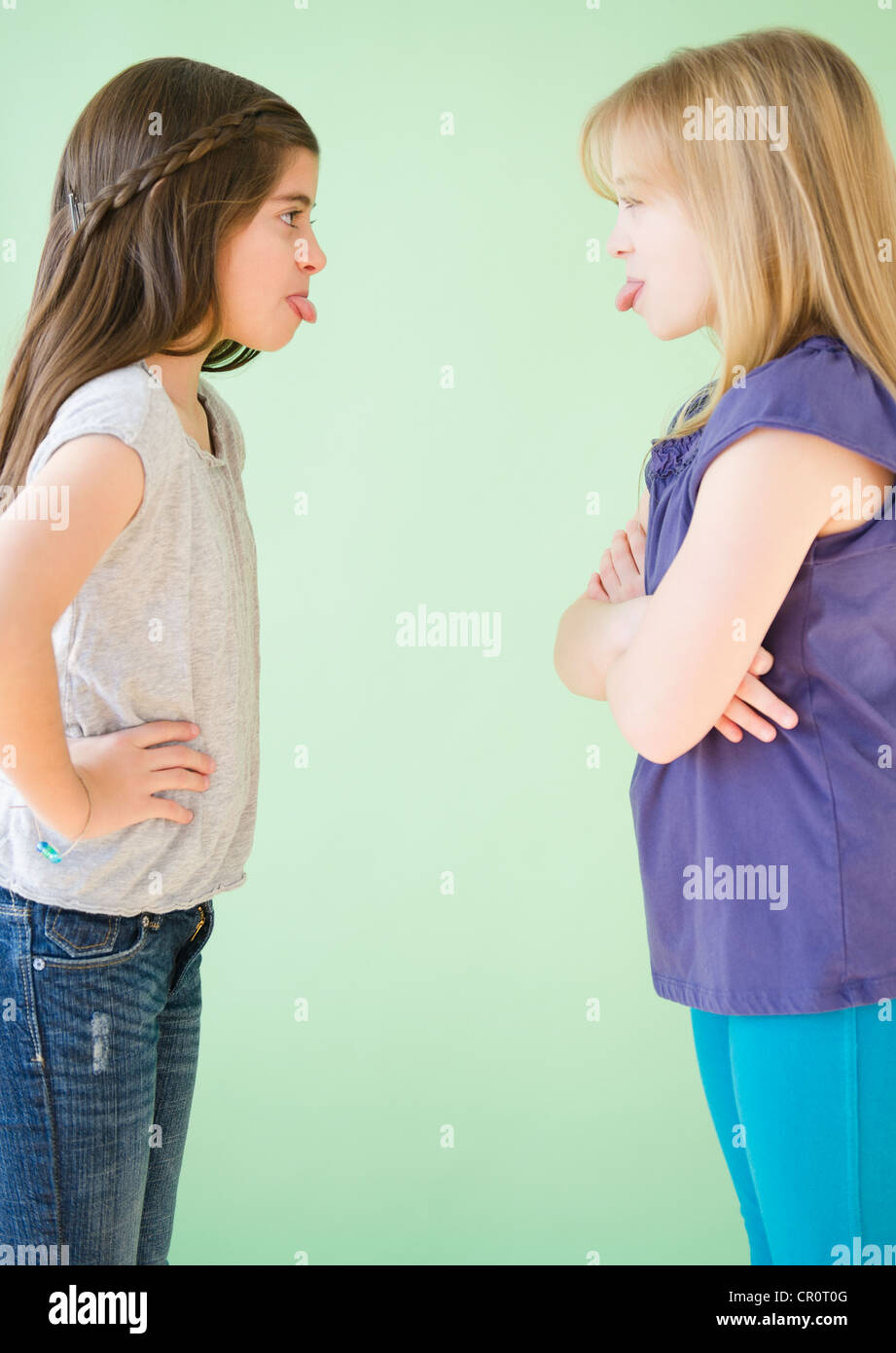 USA, New Jersey, Jersey City, Two girls standing face to face and ...