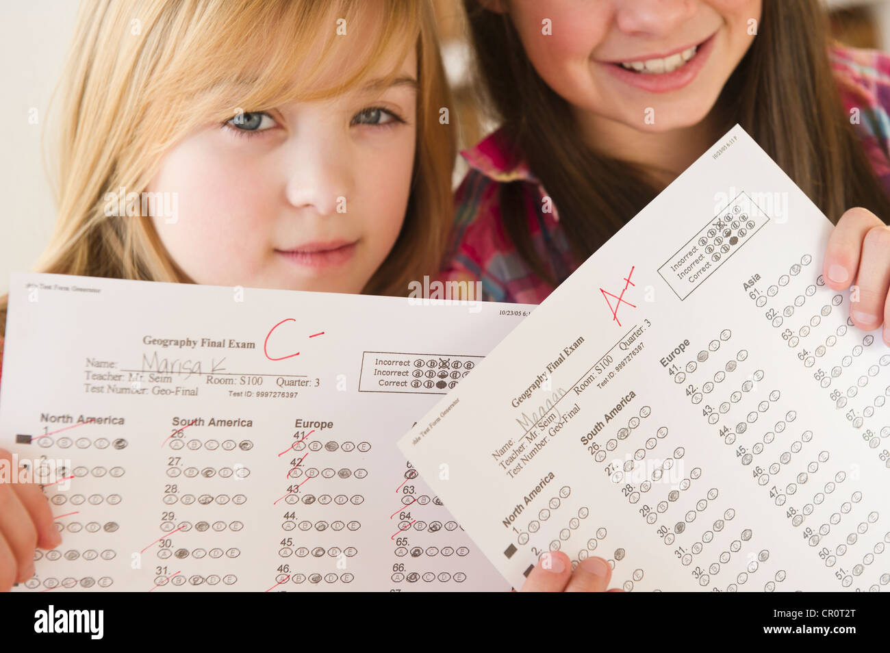 USA, New Jersey, Jersey City, Close up of two girls showing test ...