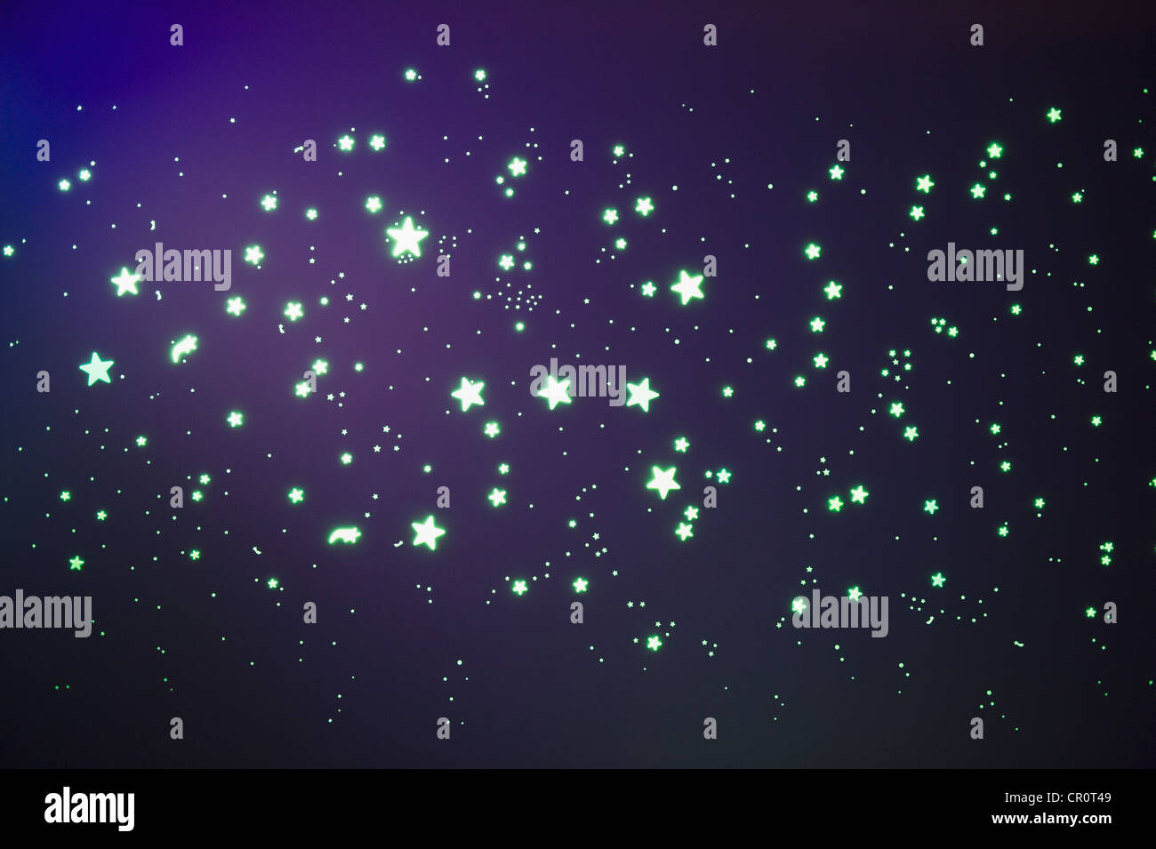 Fluorescent stars on blue background, studio shot Stock Photo - Alamy