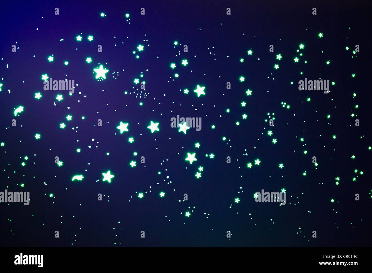 Fluorescent stars on blue background, studio shot Stock Photo - Alamy