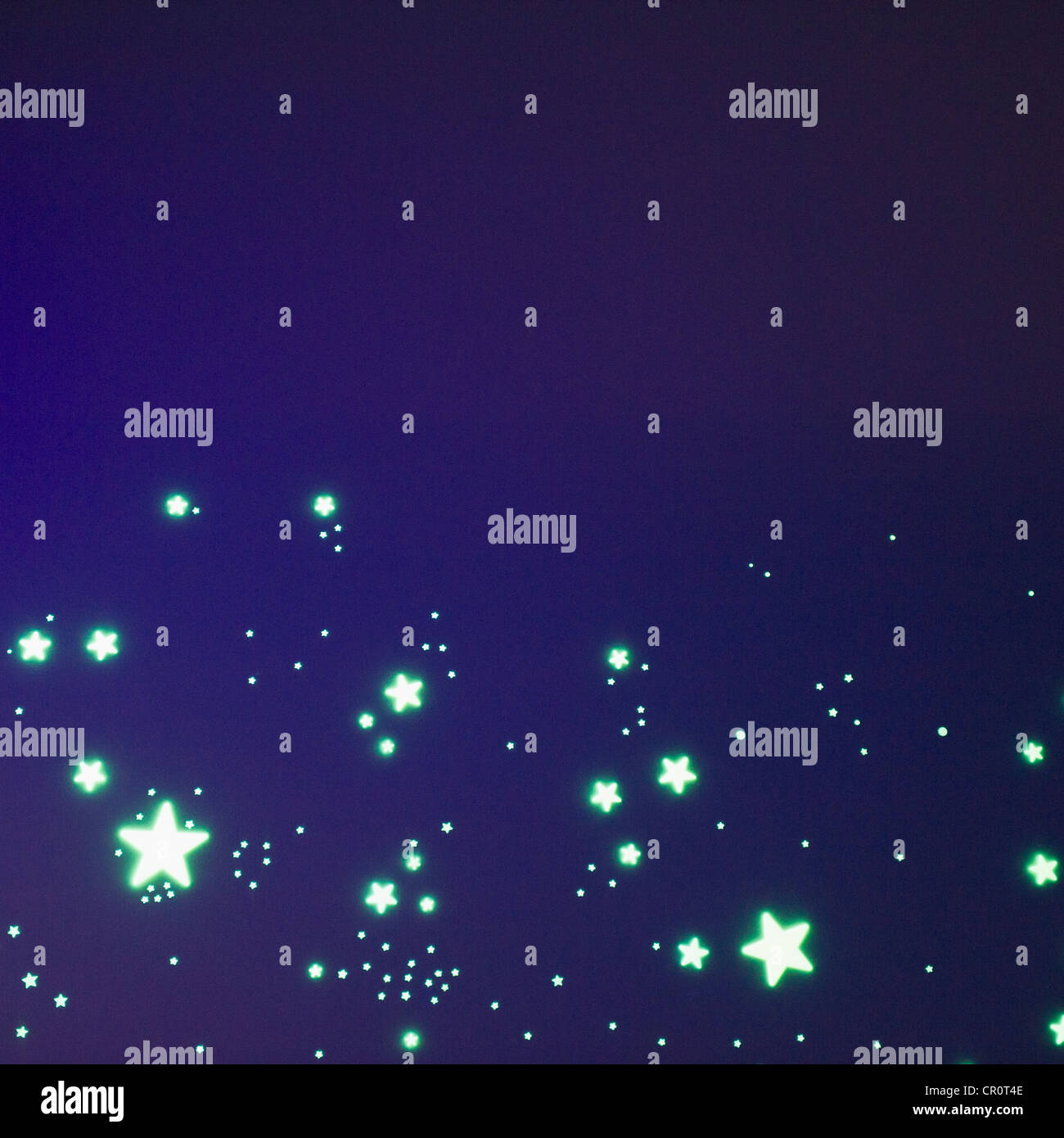 Fluorescent stars on blue background, studio shot Stock Photo - Alamy