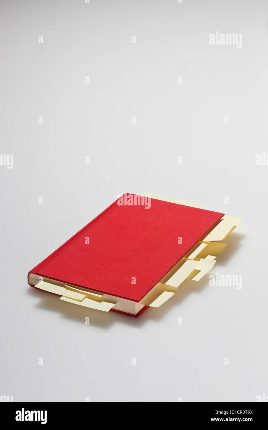 Red book with Post-its Stock Photo - Alamy