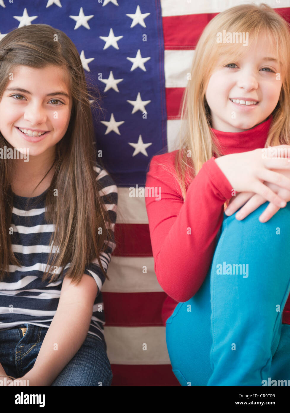 USA, New Jersey, Jersey City, Portrait up of two girls in front of ...