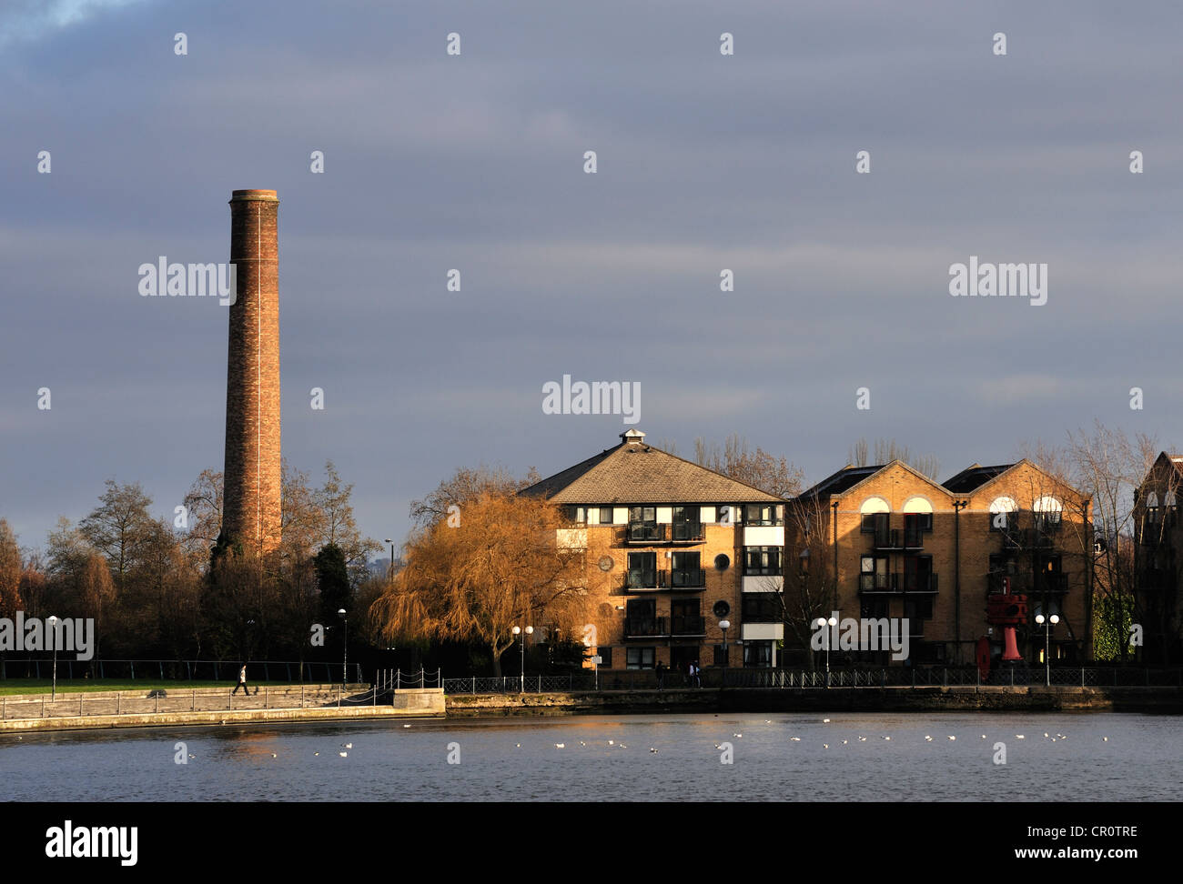 Chimney and houses at Millwall Dock, London, UK Stock Photo - Alamy