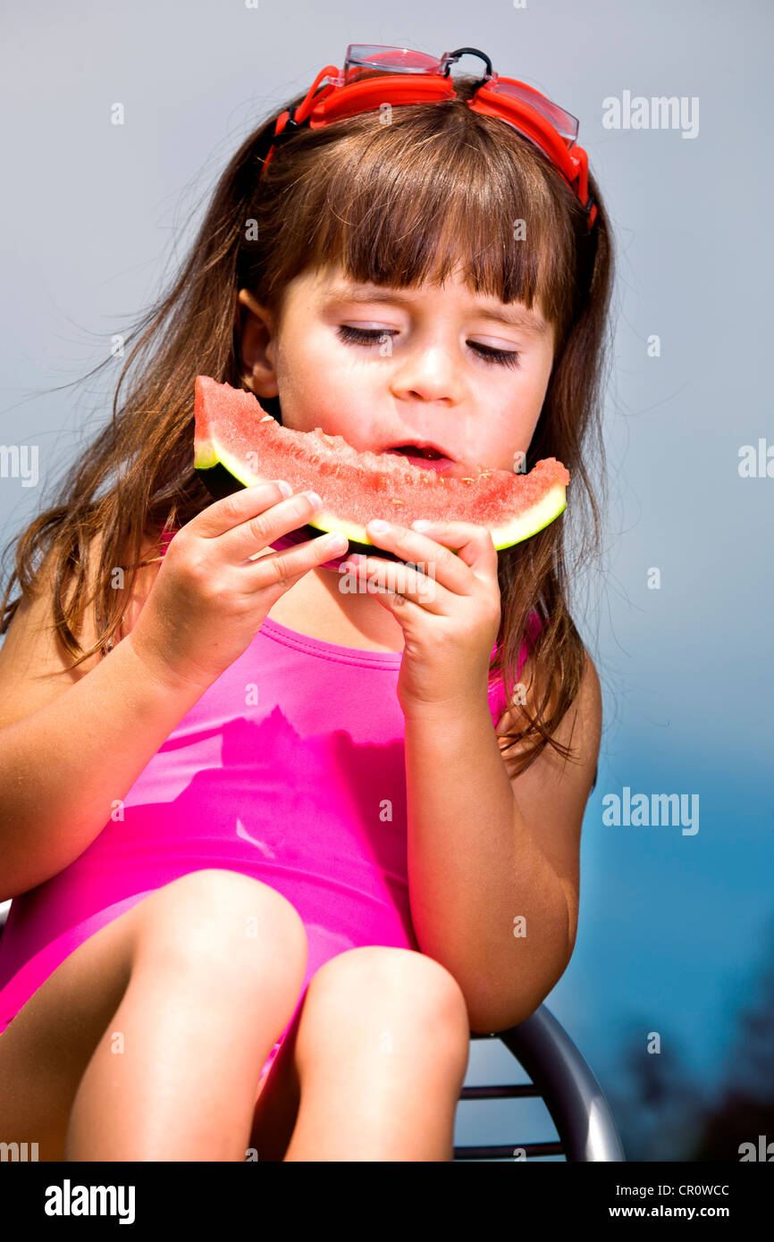 Girl eating watermelon Stock Photo - Alamy
