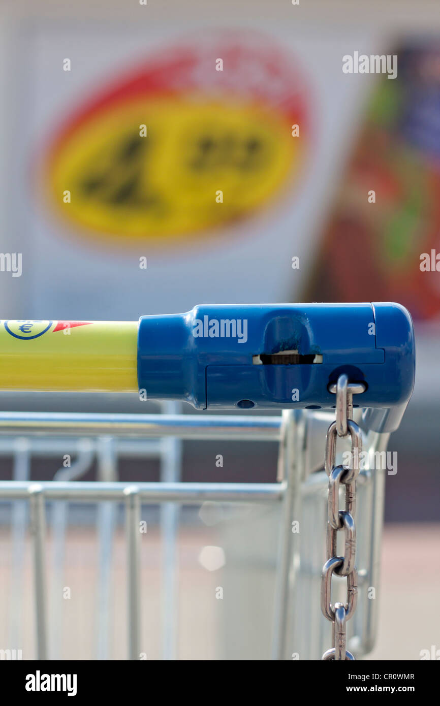 Shopping cart in shop abstract background Stock Photo - Alamy